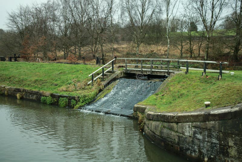 Waterfall Running Under a Bridge Stock Image - Image of trees ...