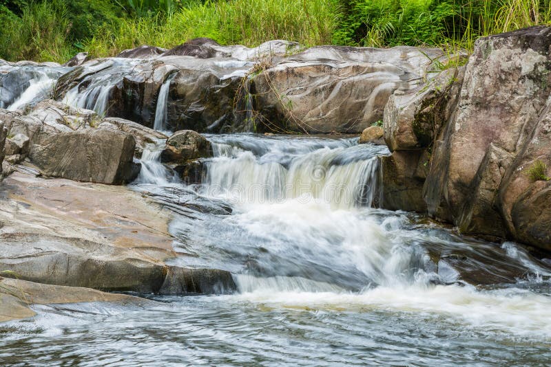 Waterfall Cascades Flowing Over Flat Rocks in Forest Stock Image ...