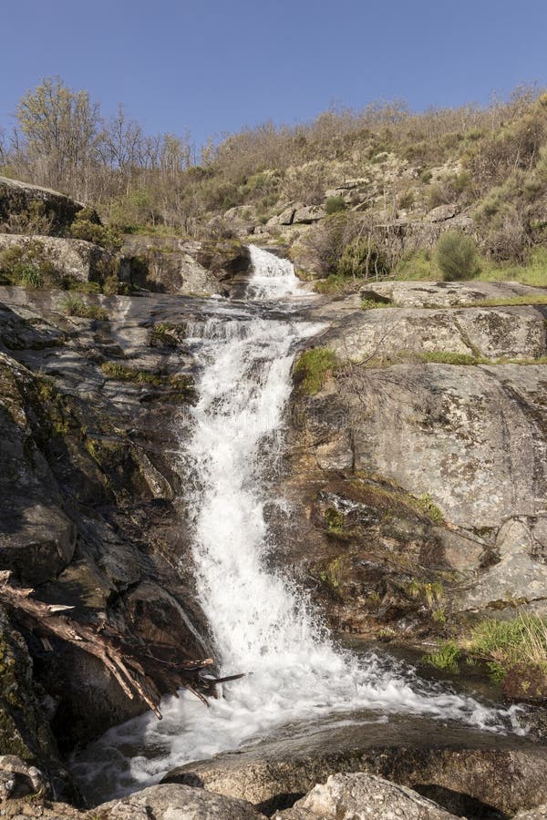 Waterfall Cascading Down Rocks in Natural Landscape Stock Image - Image ...