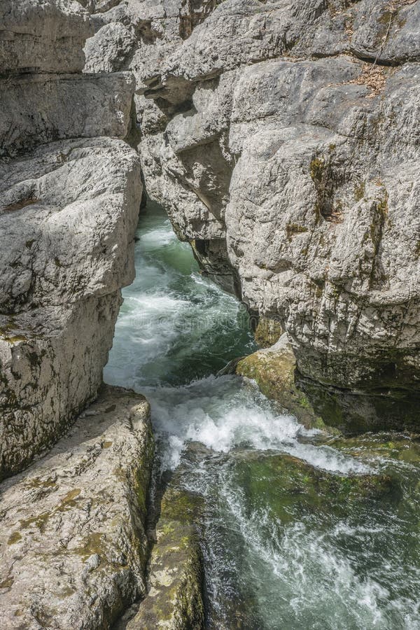 Waterfall Cascading Over Rocks in Blue Pond Stock Image - Image of pool ...