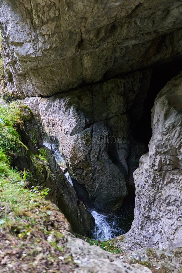 Waterfall in a cave stock image. Image of cascade, forest - 259589677