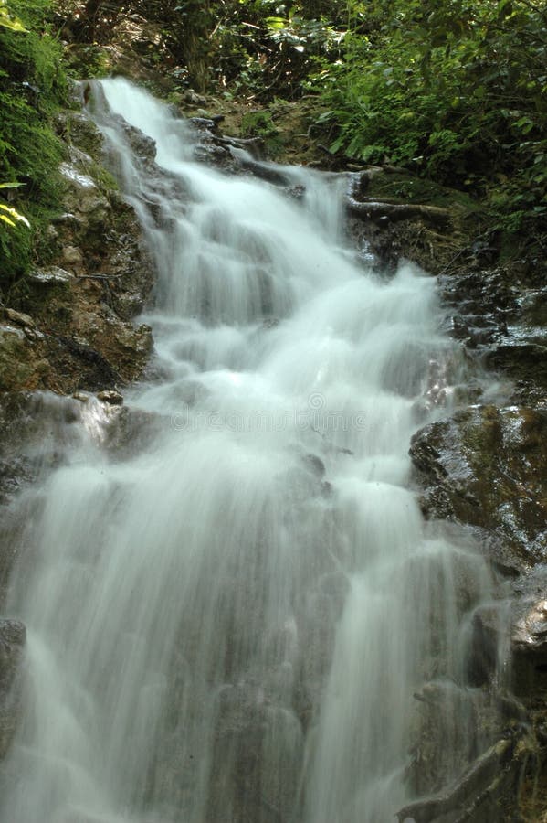 Waterfall in countryside stock image. Image of blur, greenery - 20711433