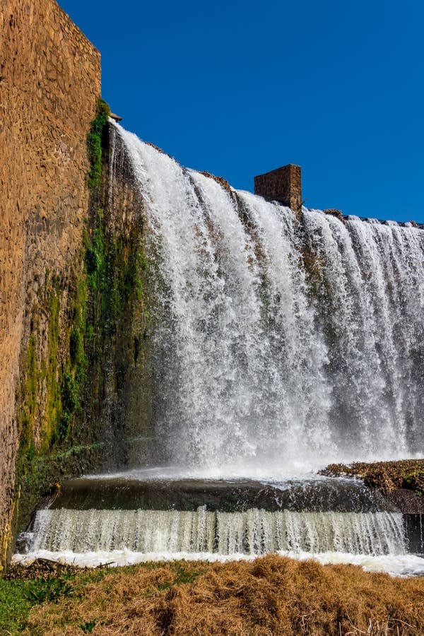 Waterfall at a dam stock photo. Image of nature, lake - 211449542