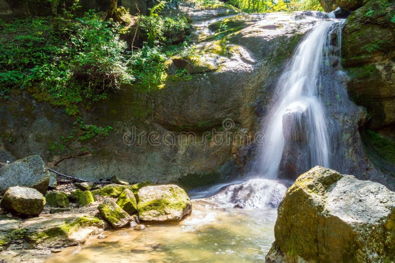 Waterfall in dark forest stock image. Image of natural - 75648167