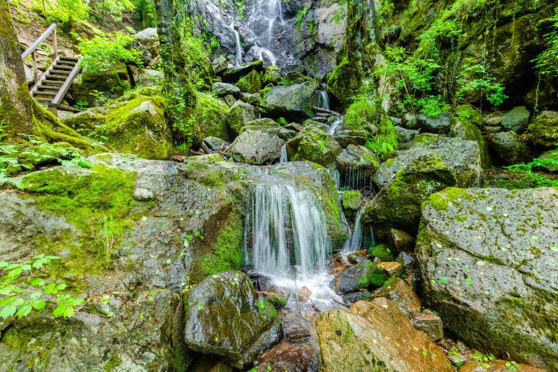 Waterfall in Deep Mountain with Large Rocks in Spring Stock Image ...