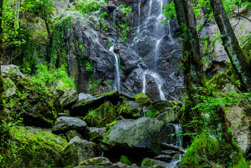Waterfall in Deep Mountain with Large Rocks in Spring Stock Photo ...