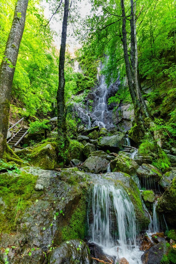 Waterfall in Deep Mountain with Large Rocks in Spring Stock Photo ...