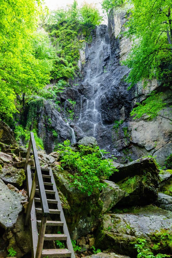 Waterfall in Deep Mountain with Large Rocks in Spring Stock Image ...