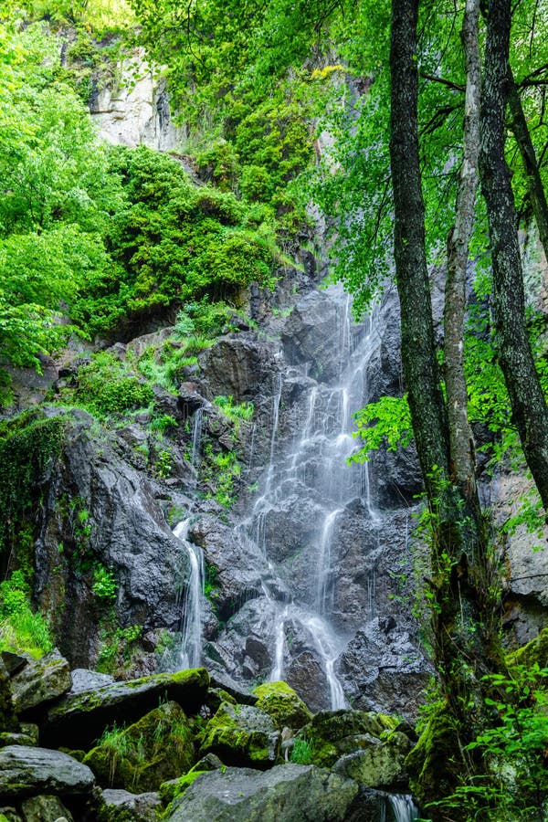 Waterfall in Deep Mountain with Large Rocks in Spring Stock Photo ...