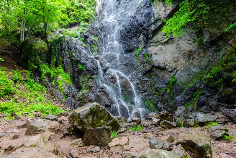 Waterfall in Deep Mountain with Large Rocks in Spring Stock Image ...