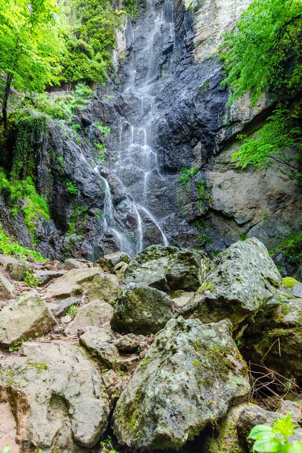 Waterfall in Deep Mountain with Large Rocks in Spring Stock Image ...