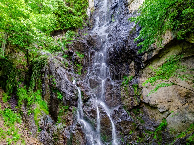 Waterfall in Deep Mountain with Large Rocks in Spring Stock Image ...