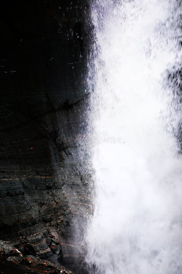 Waterfall Detail with Dark Rock Cliff and Bright Spray Stock Photo ...