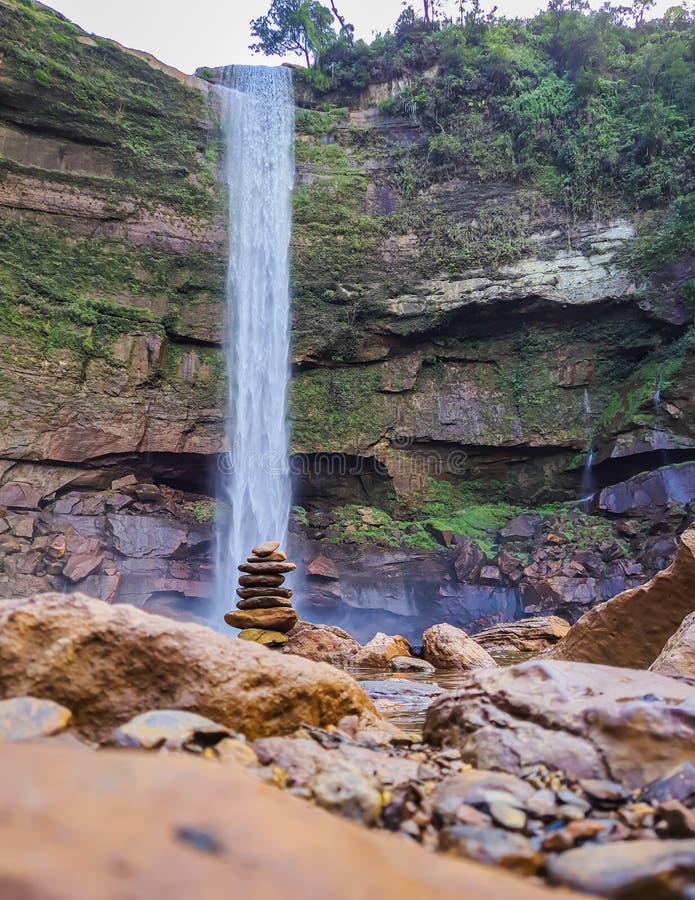 Waterfall Falling from Mountain with Pile of Stones at Day from ...