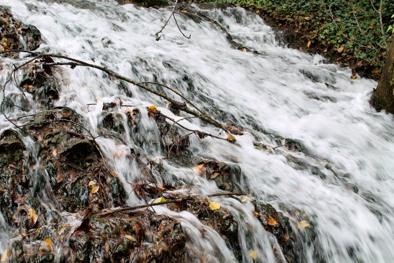 Waterfall Falling through the Stones in the Forest Stock Photo - Image ...