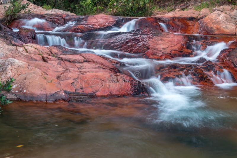 Waterfall Flowing Down Over Rocks Stock Photo - Image of falls ...