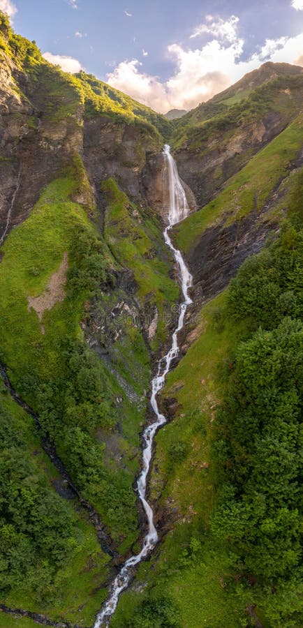 A waterfall flowing down stock image. Image of scenery - 270633073