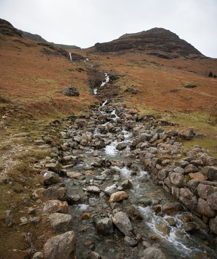 A Waterfall Flowing into Lake Buttermere, Cumbria in the UK Stock Image ...