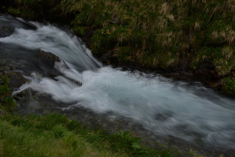 Waterfall Flowing in the Mountain Trough the Stones in Cloudy Day in ...