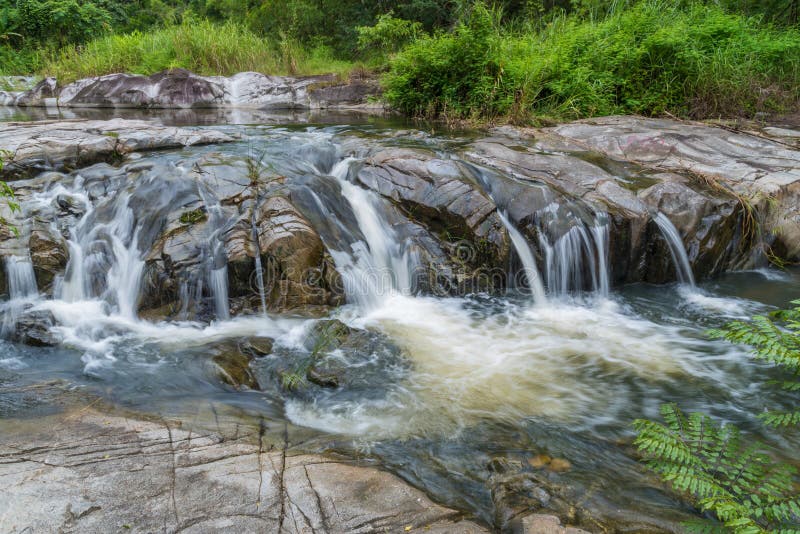 Waterfall Cascades Flowing Over Flat Rocks in Forest Stock Image ...