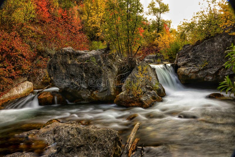 Waterfall Flowing Over the Rocks Stock Photo - Image of season, lake ...