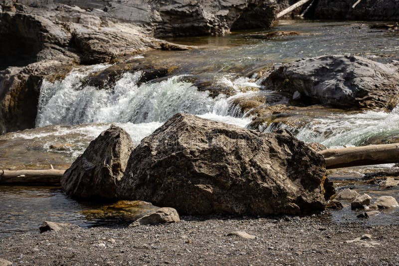 Waterfall Flowing in a Rocky Area Under the Sunlight Stock Image ...