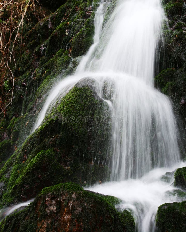 Waterfall with Flowing Water Over Rocks in a Forest Stock Photo - Image ...