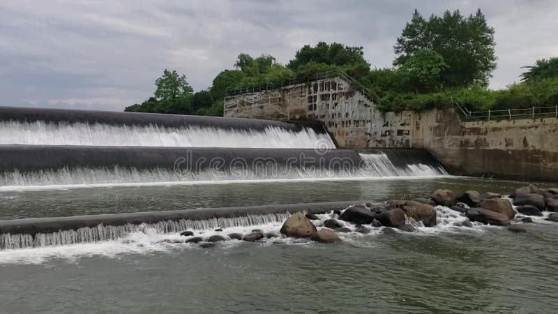 The Waterfall Flows from the River Dam Stock Video - Video of waterfall ...