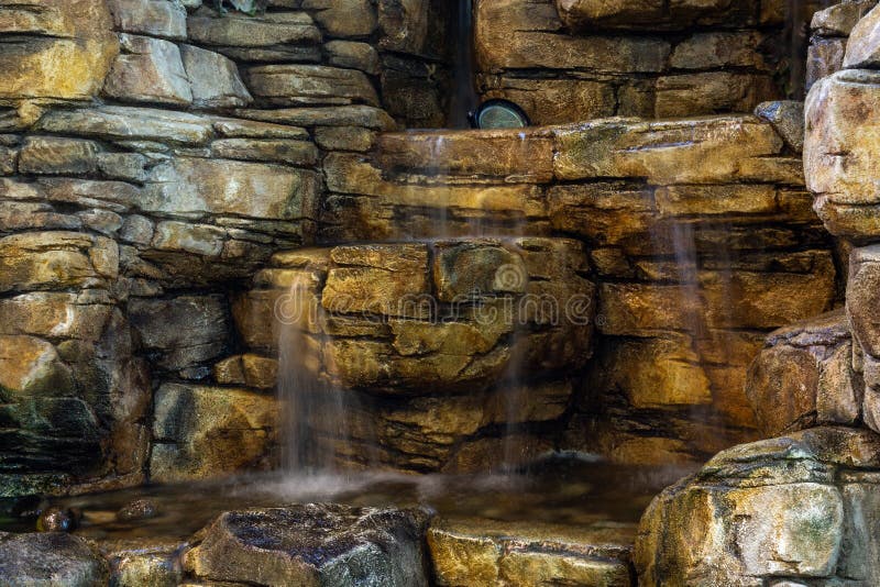 A Waterfall Flows from a Cliff. Stock Photo - Image of close, stone ...