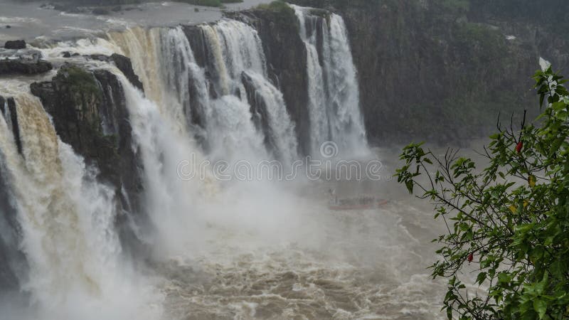 Waterfall Flows Collapse from a Cliff Ledge into a Stormy River. Stock ...