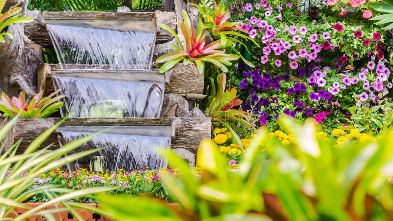 Waterfall Flows in Cozy Home Flower Garden Stock Photo - Image of park ...