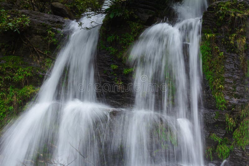 Waterfall Flows Down the Long Line of Cliffs Stock Photo - Image of ...