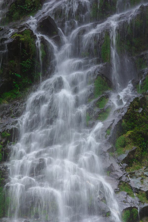 Waterfall Flows Down the Long Line of Cliffs Stock Photo - Image of ...