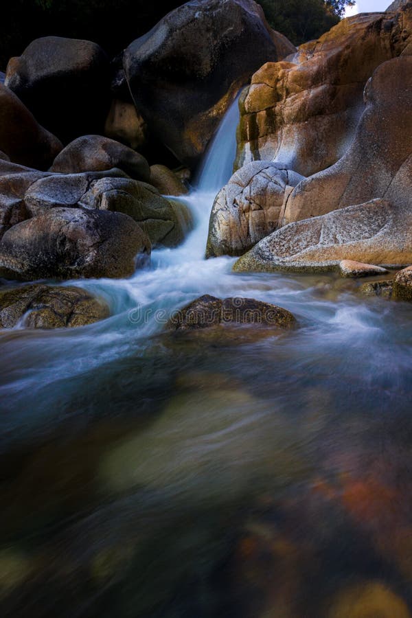 Waterfall flows form rocks stock photo. Image of flows - 218479600