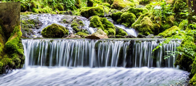 Waterfall in forest stock photo. Image of blue, forest - 63006264