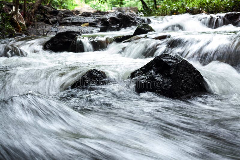 Waterfall from a Forest Stream with Moss Covered Rock Stock Photo ...