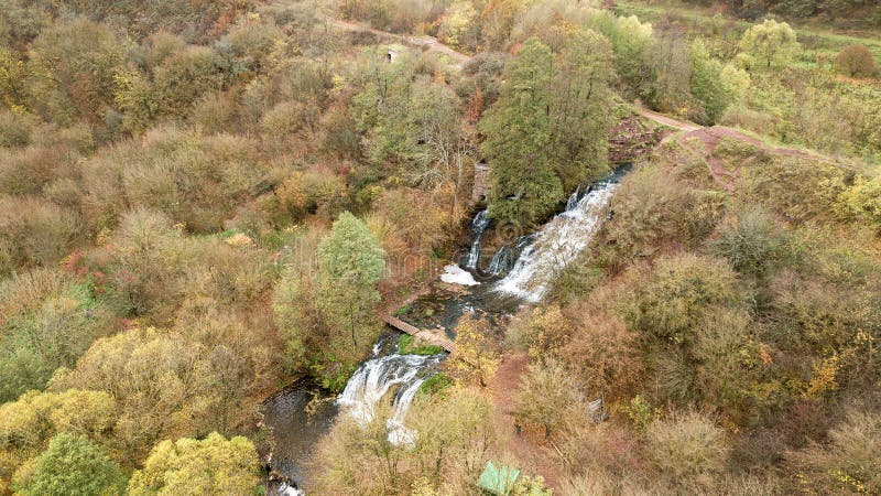 Waterfall in the Forest from the Trees Covered with Yellow Foliage ...