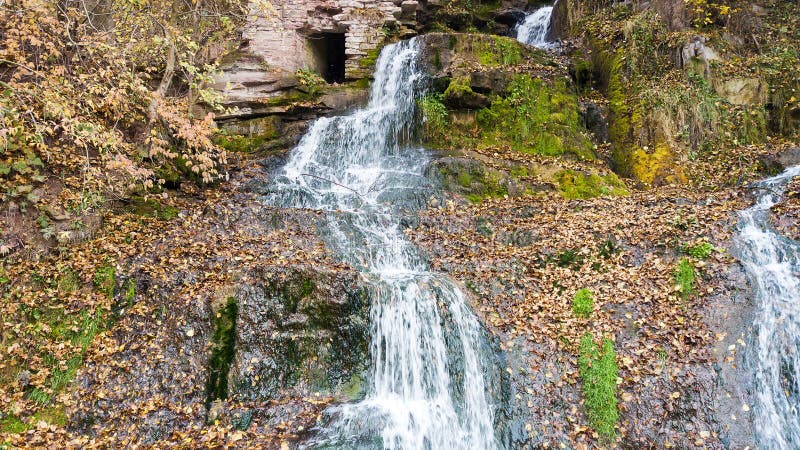 Waterfall in the Forest from the Trees Covered with Yellow Foliage ...