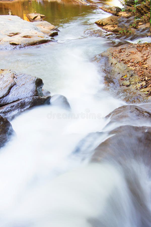 A waterfall in the forrest stock image. Image of green - 67345751