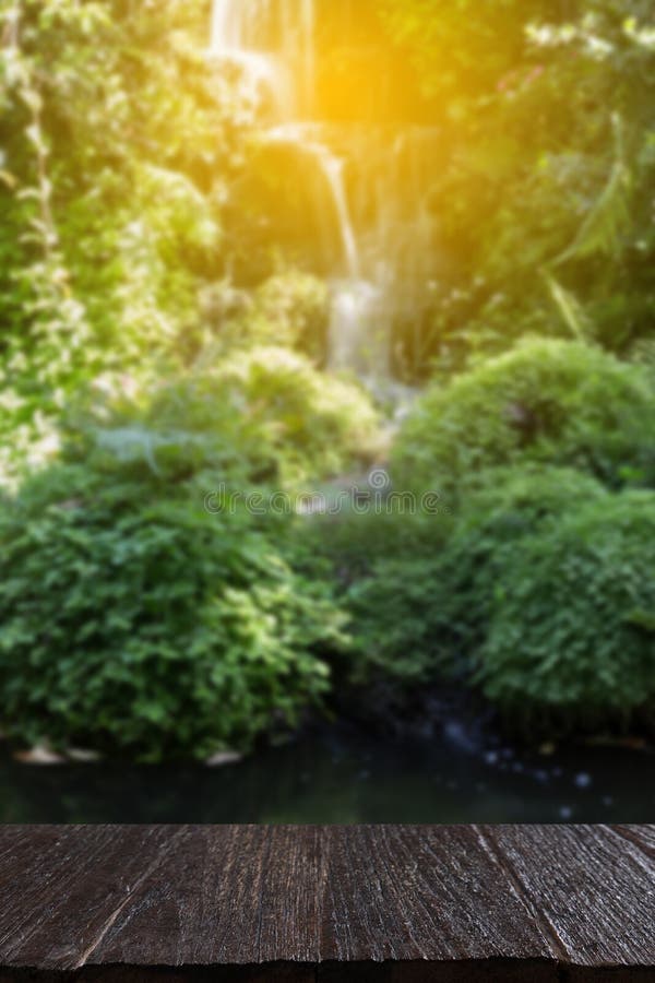 Waterfall in Garden with Wood Table for Display Your Product Stock ...