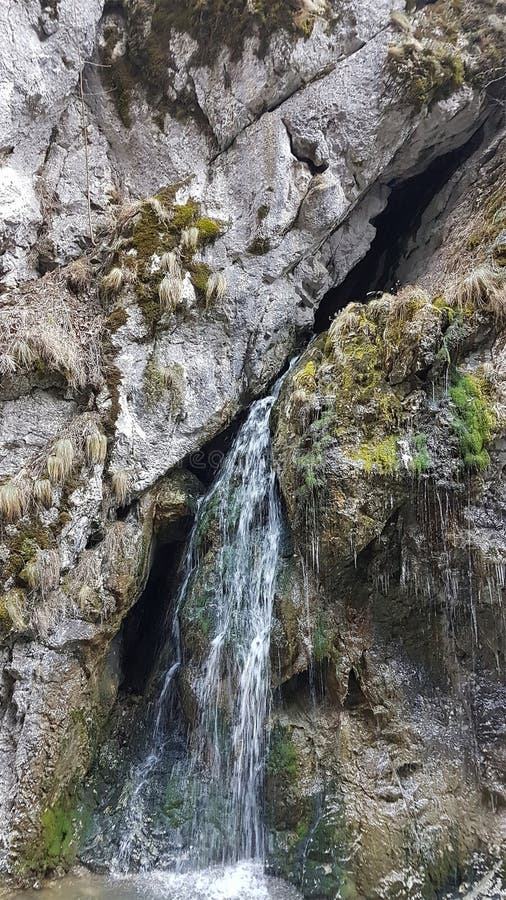 Waterfall into the Hight Rocks of Mountain Area Stock Photo - Image of ...