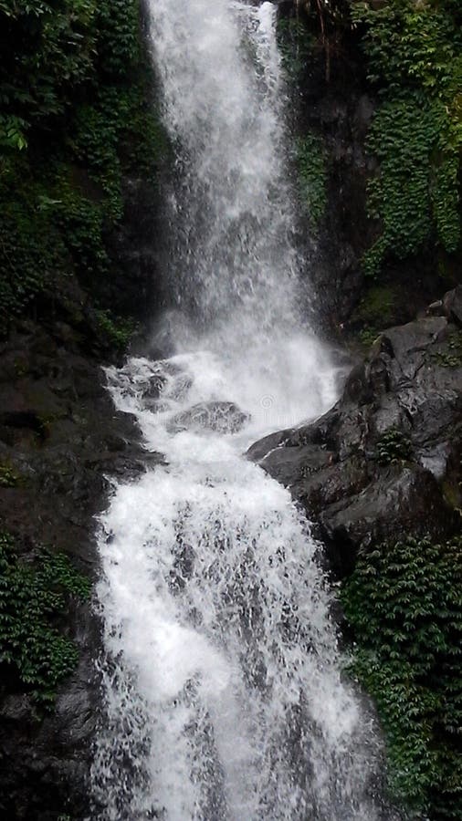 Waterfall on a hill stock photo. Image of trees, hill - 151846956