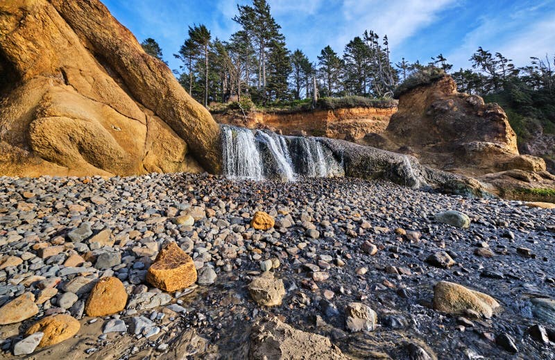Waterfall at Hug Point stock image. Image of tide, trees - 205858817