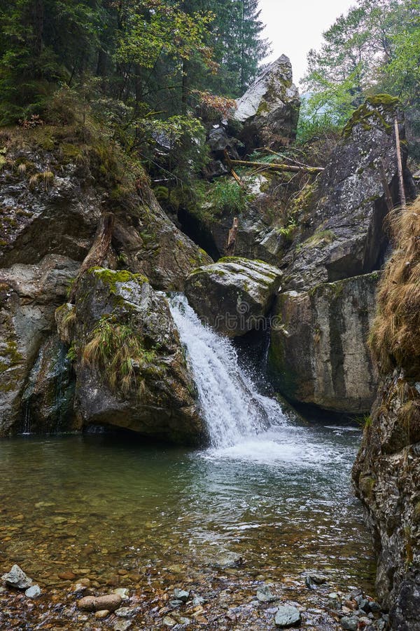 Waterfall and Huge Boulders Stock Image - Image of attraction, creek ...