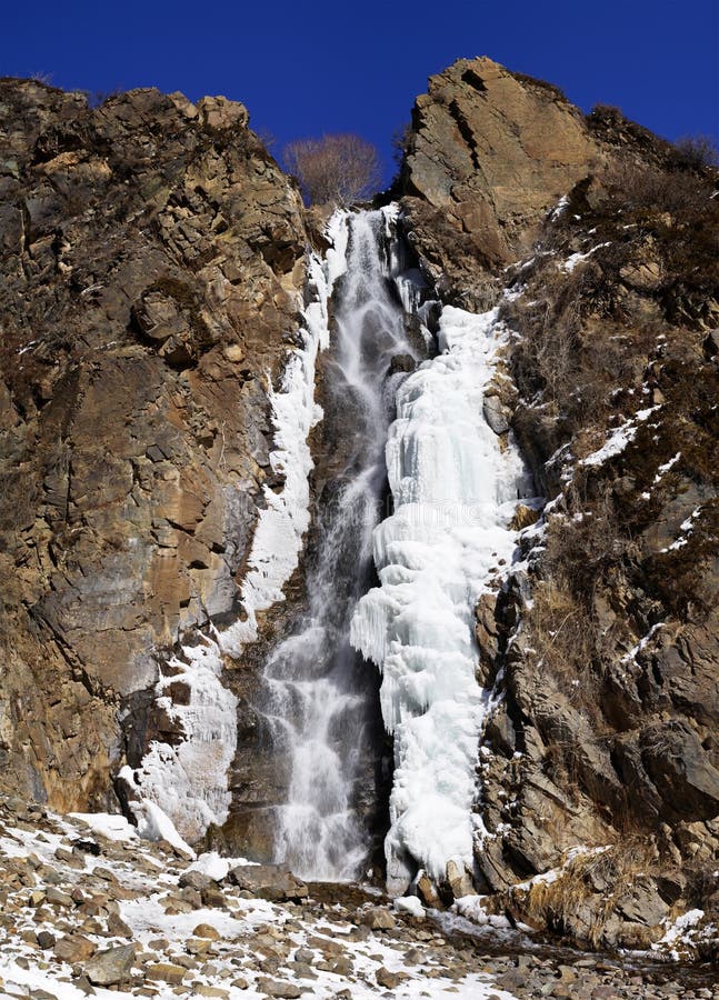 Waterfall, Ice, Rock and Blue Sky Stock Photo - Image of blue ...