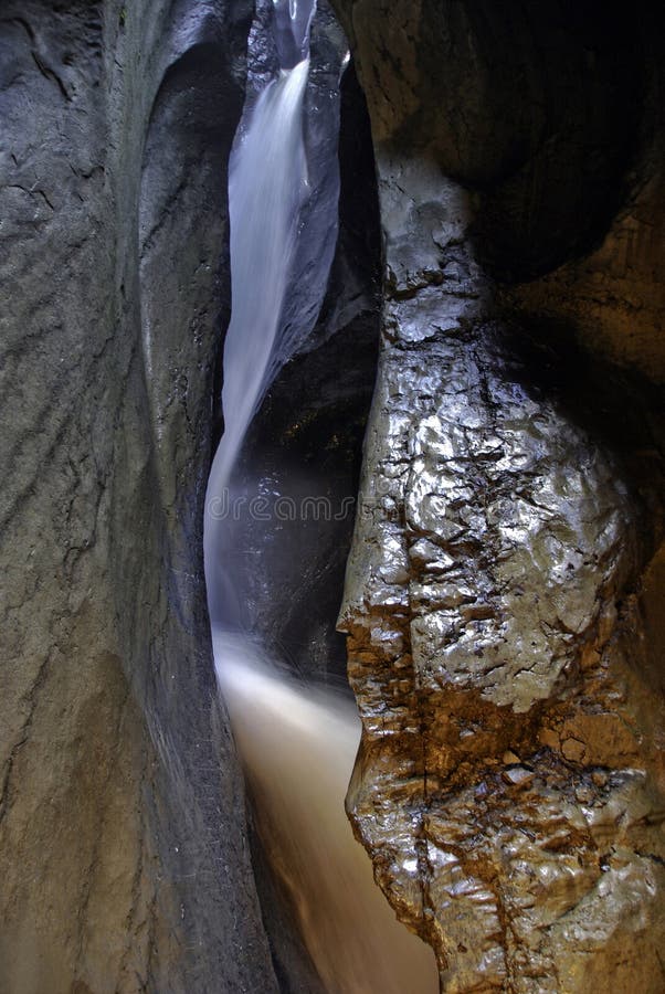 Waterfall inside the rock stock image. Image of switzerland - 25778421