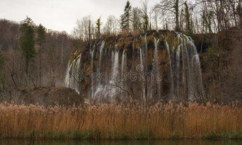 Waterfall with large rocks stock image. Image of flowing - 55351253