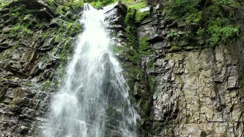 Mountain Waterfall Bottom View with a Green Forest on the Top, Aerial ...