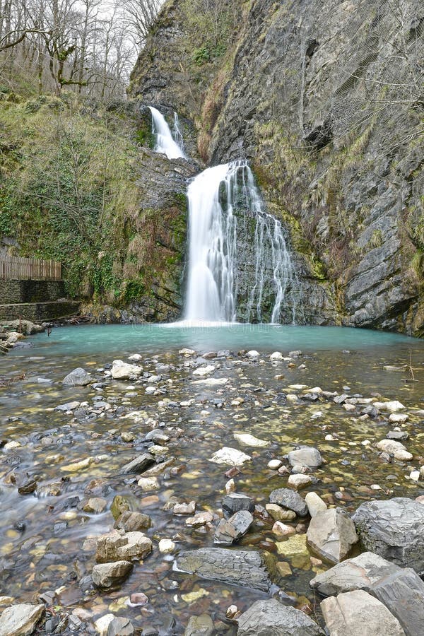 Waterfall in a Mountain Forest in Early Spring Stock Photo - Image of ...