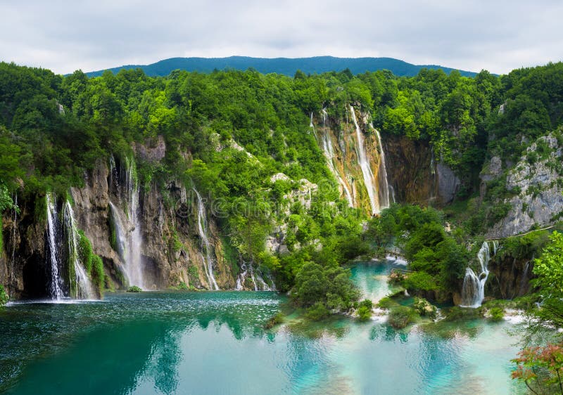 Waterfall in mountain stock image. Image of reflection - 56064909